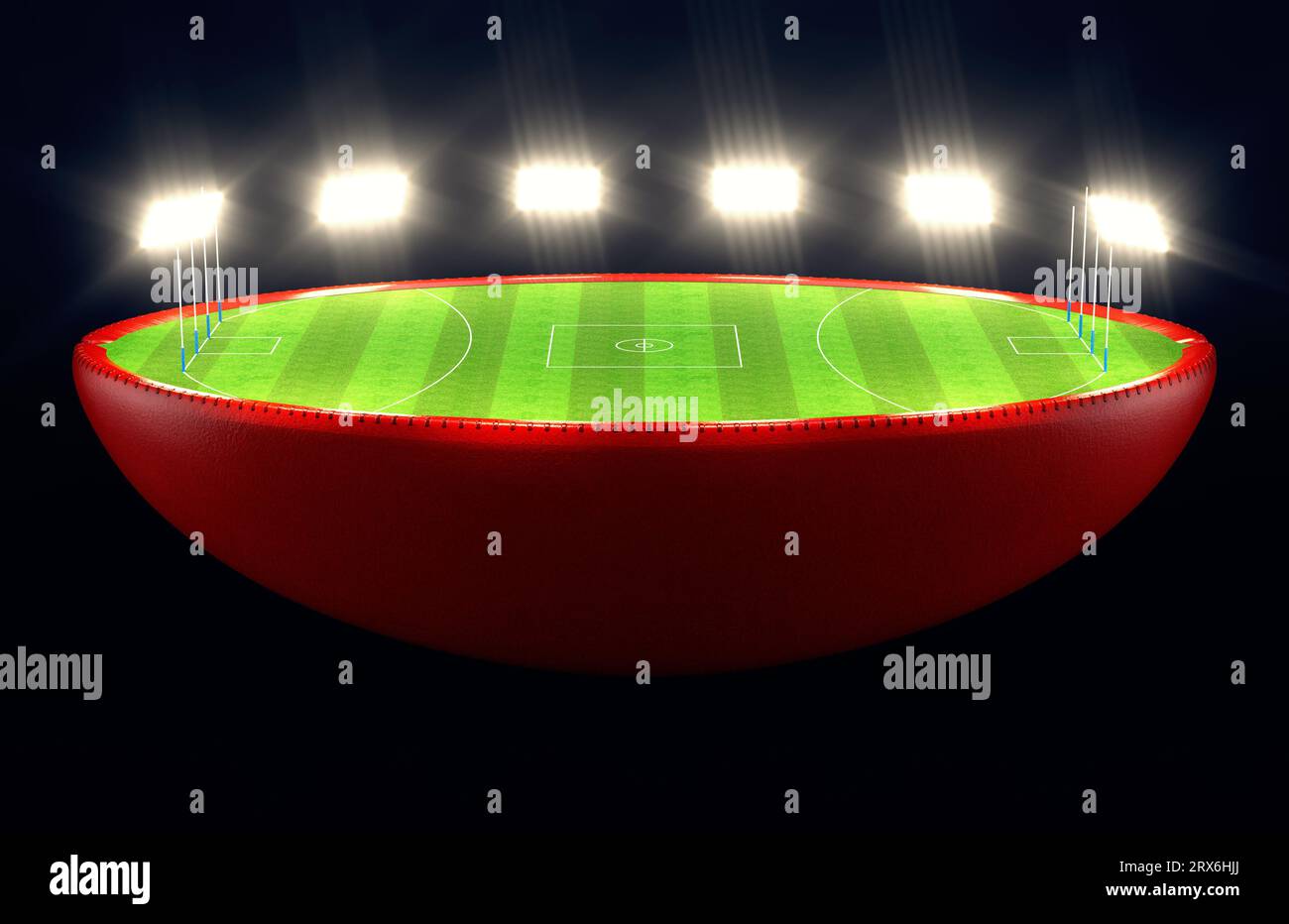 An ausralian rules ball split in half revealing a marked green grass ...