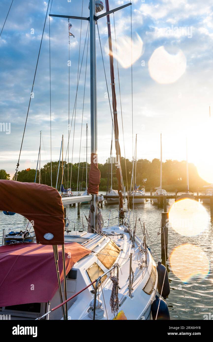 Germany, Mecklenburg-Vorpommern, Krummin, Boat moored in marina with ...