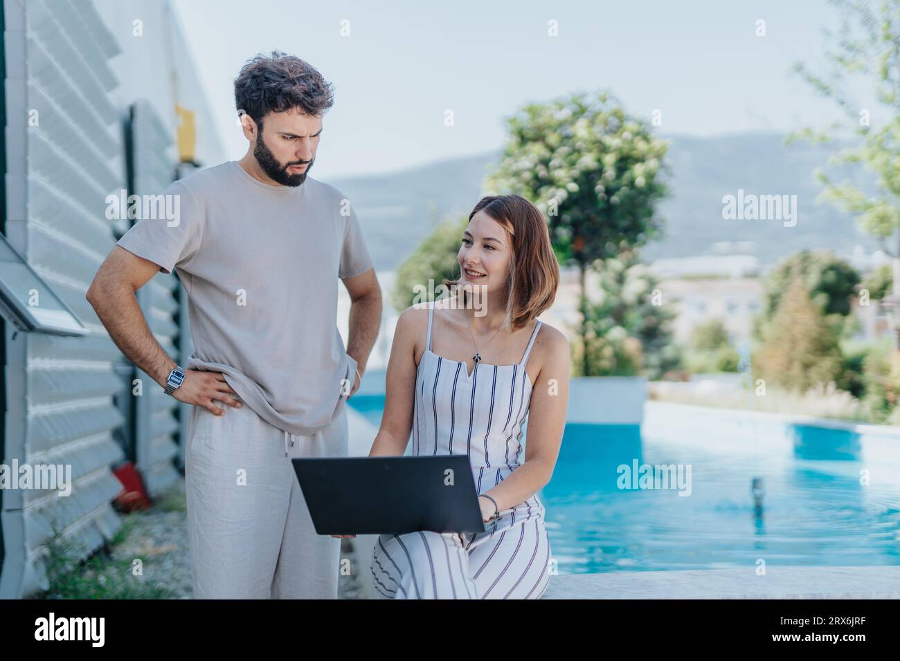 Confident Business Partners Sitting but Pool Discussing Statistics in ...