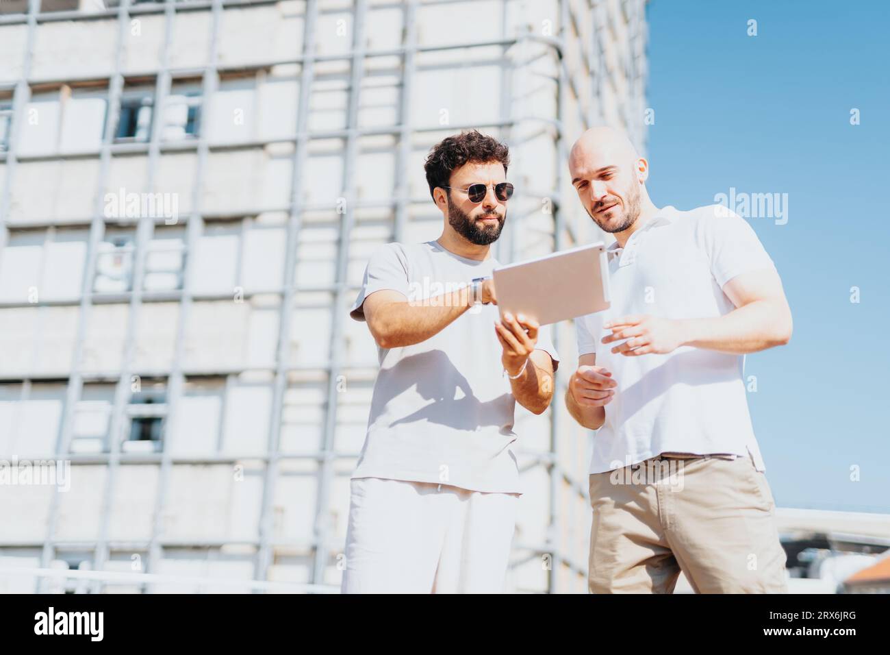 Successful Urban Architects Collaborating on Building Construction ...