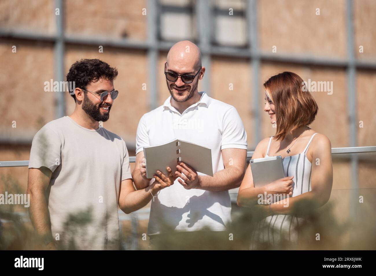 A team of architects and engineers collaborating on a modern building ...