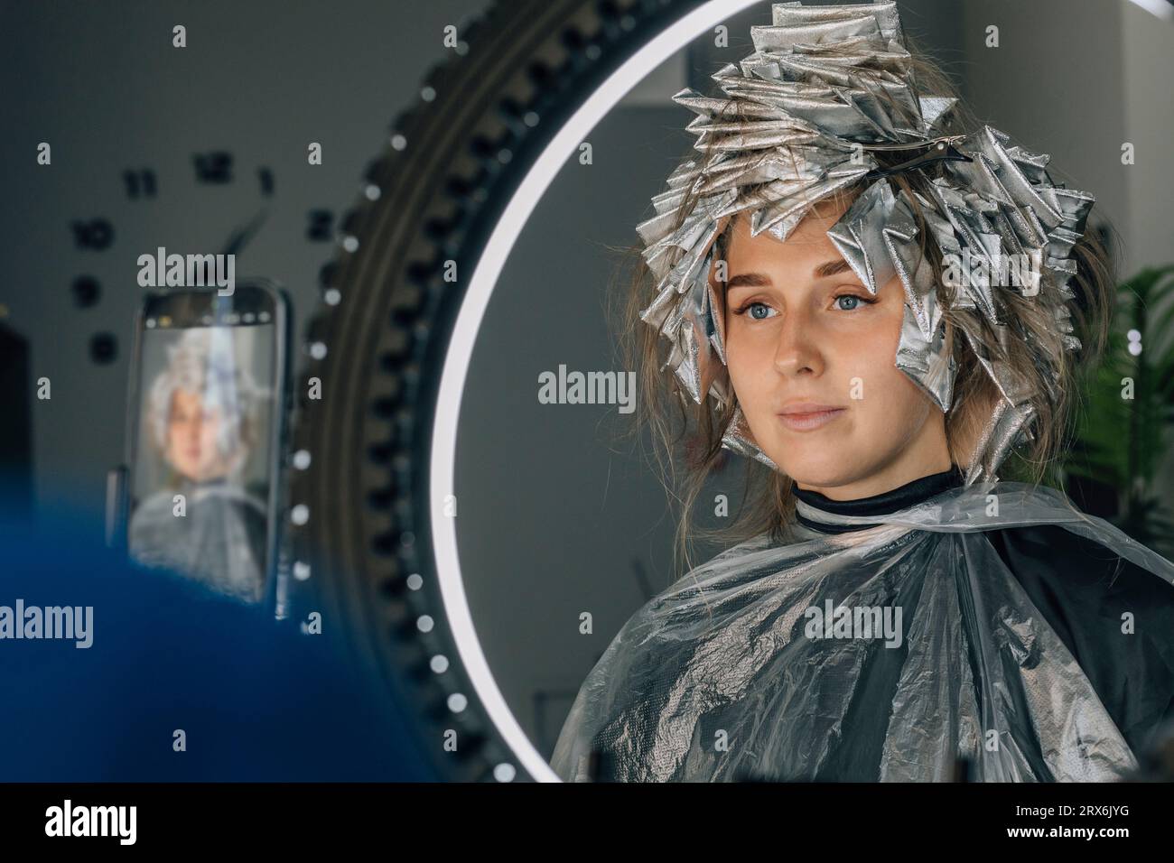 Woman with salon cape hi-res stock photography and images - Alamy