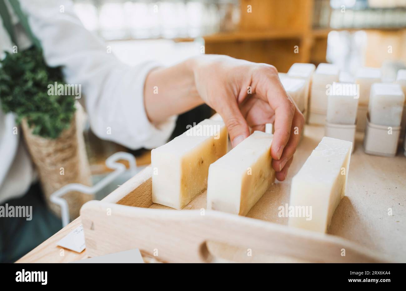 Hand of woman picking scented soap in shop Stock Photo - Alamy