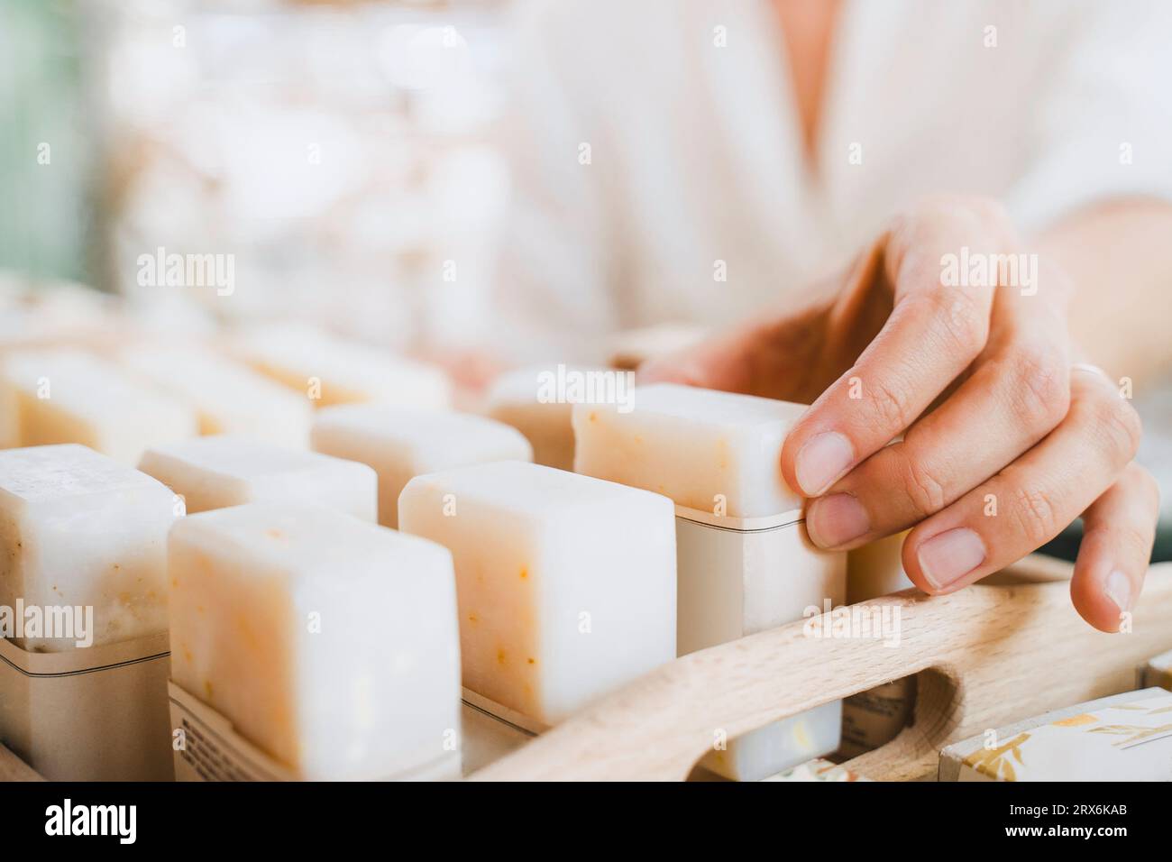 Hand of woman touching scented soap Stock Photo - Alamy