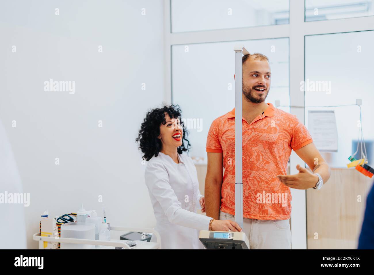 Doctors and specialists conduct medical examinations, measuring height ...