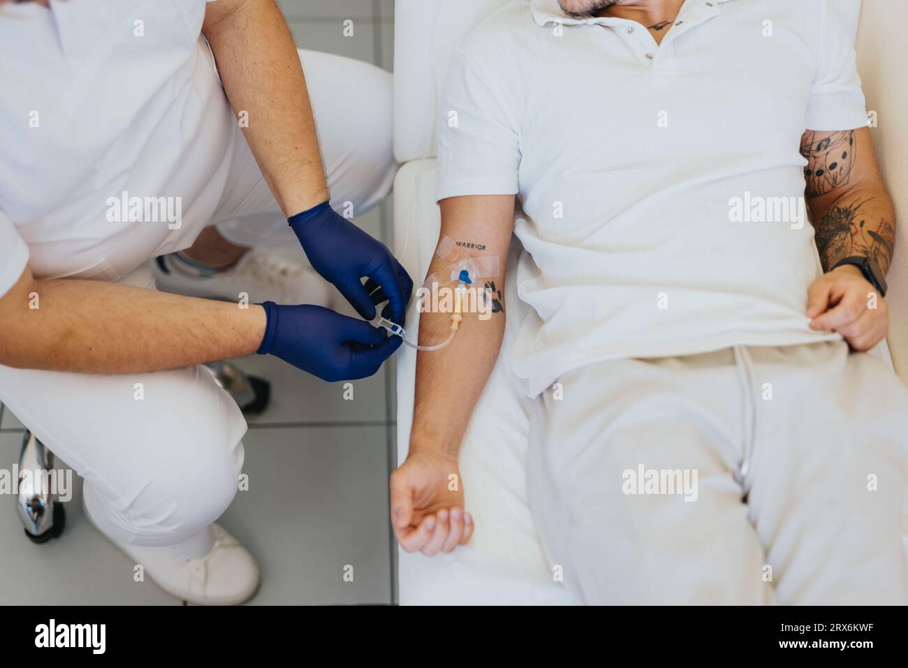 In a hospital room, doctors and nurses provide skilled healthcare ...