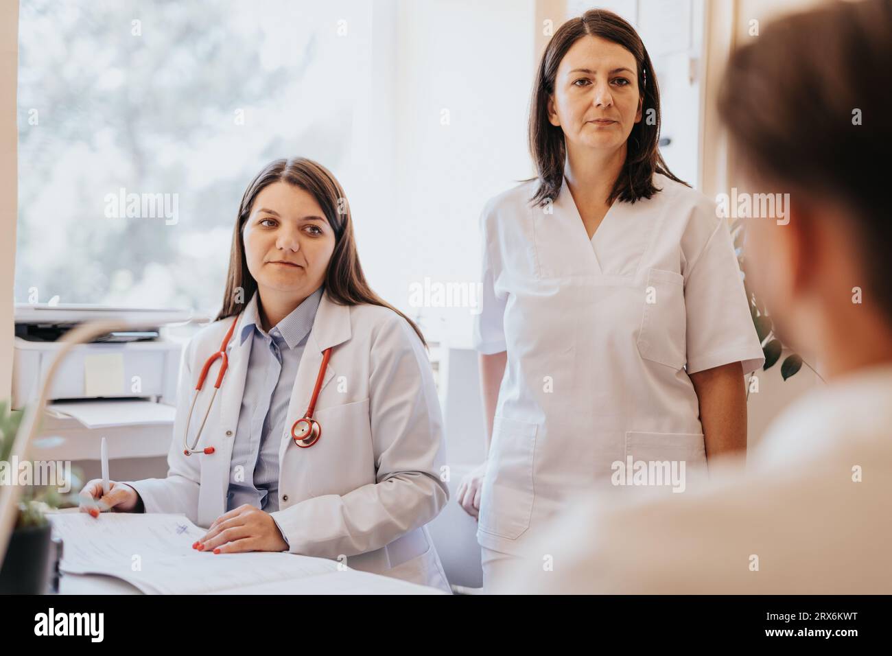 Expert medical care at a clinic. Checking blood pressure, sugar levels ...