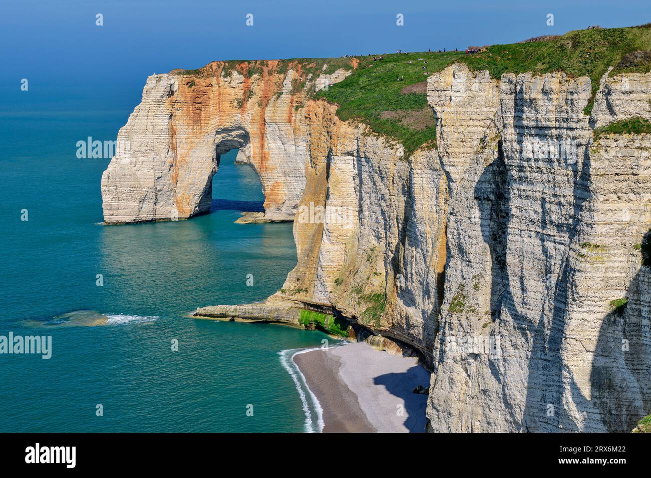 Chalk cliffs with natural arch under sky near sea Stock Photo - Alamy