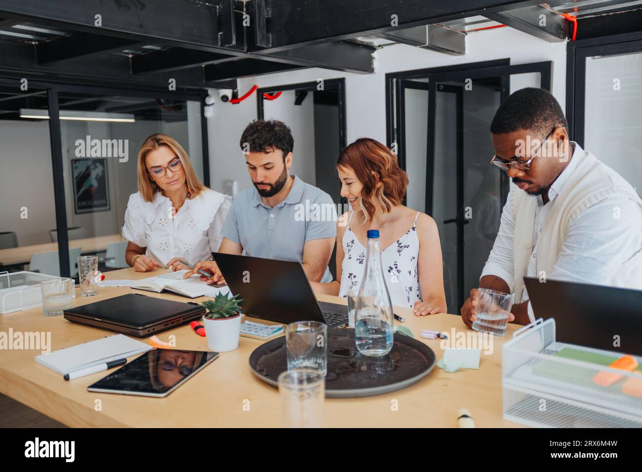 Cross generational, diverse, efficient team of confident business ...