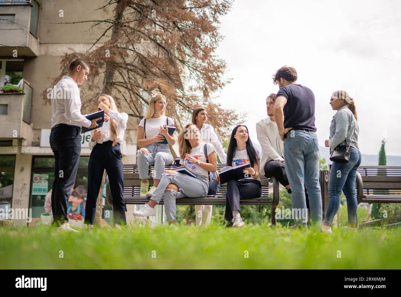 Happy, successful, multicultural college student standing outside of ...
