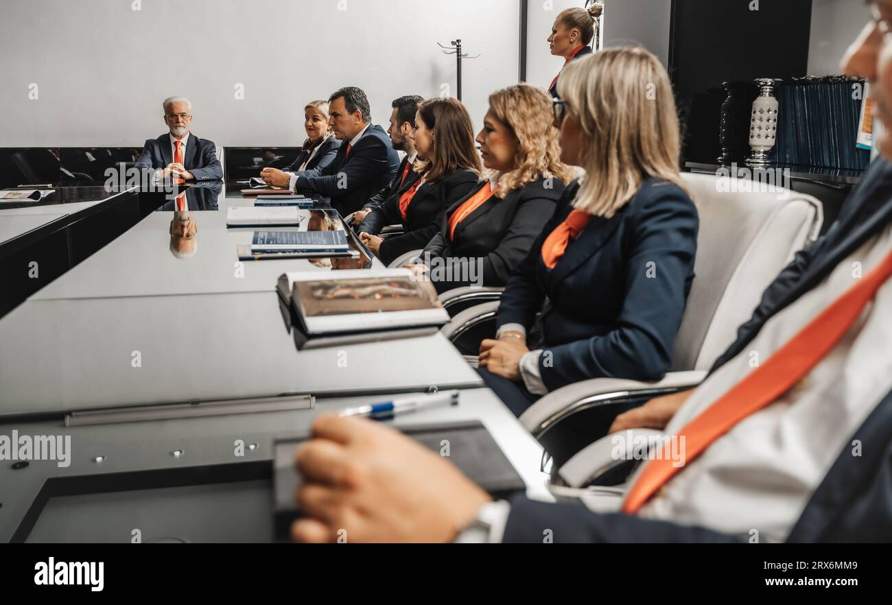 Senior managers at a conference table hi-res stock photography and ...