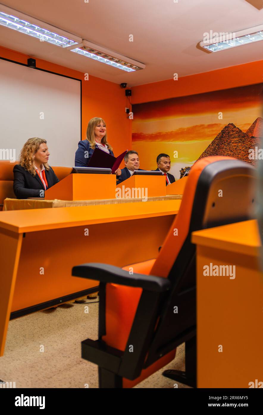 Adult university professor giving a speech in the conference room Stock ...