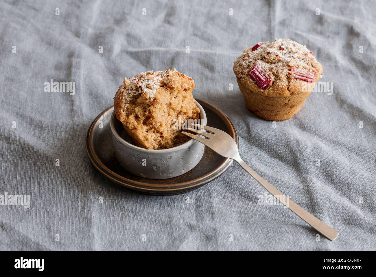 Two rhubarb muffins with one missing bite Stock Photo - Alamy