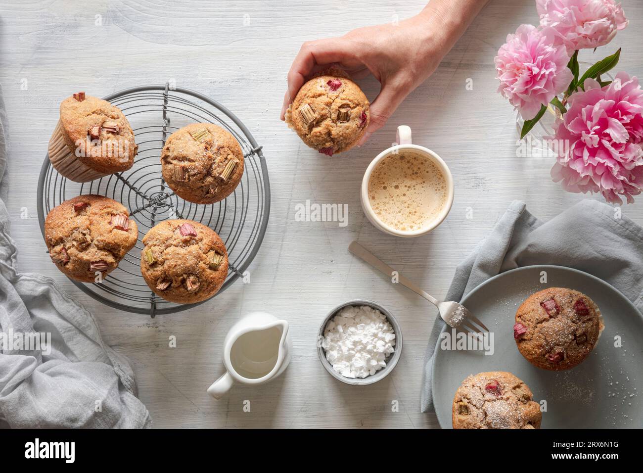 Hand picking up muffin hi-res stock photography and images - Alamy