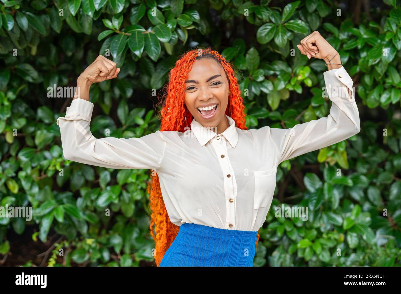 Portrait flexing arms woman hi-res stock photography and images - Alamy