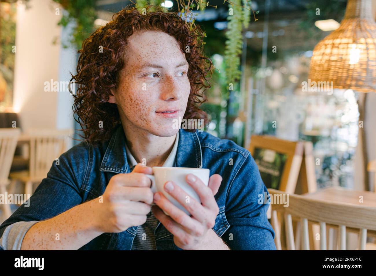 Pensive smiling man holding hi-res stock photography and images - Alamy