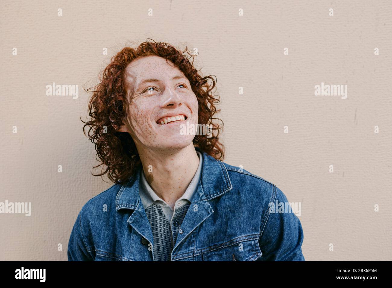Smiling man in beige hi-res stock photography and images - Alamy