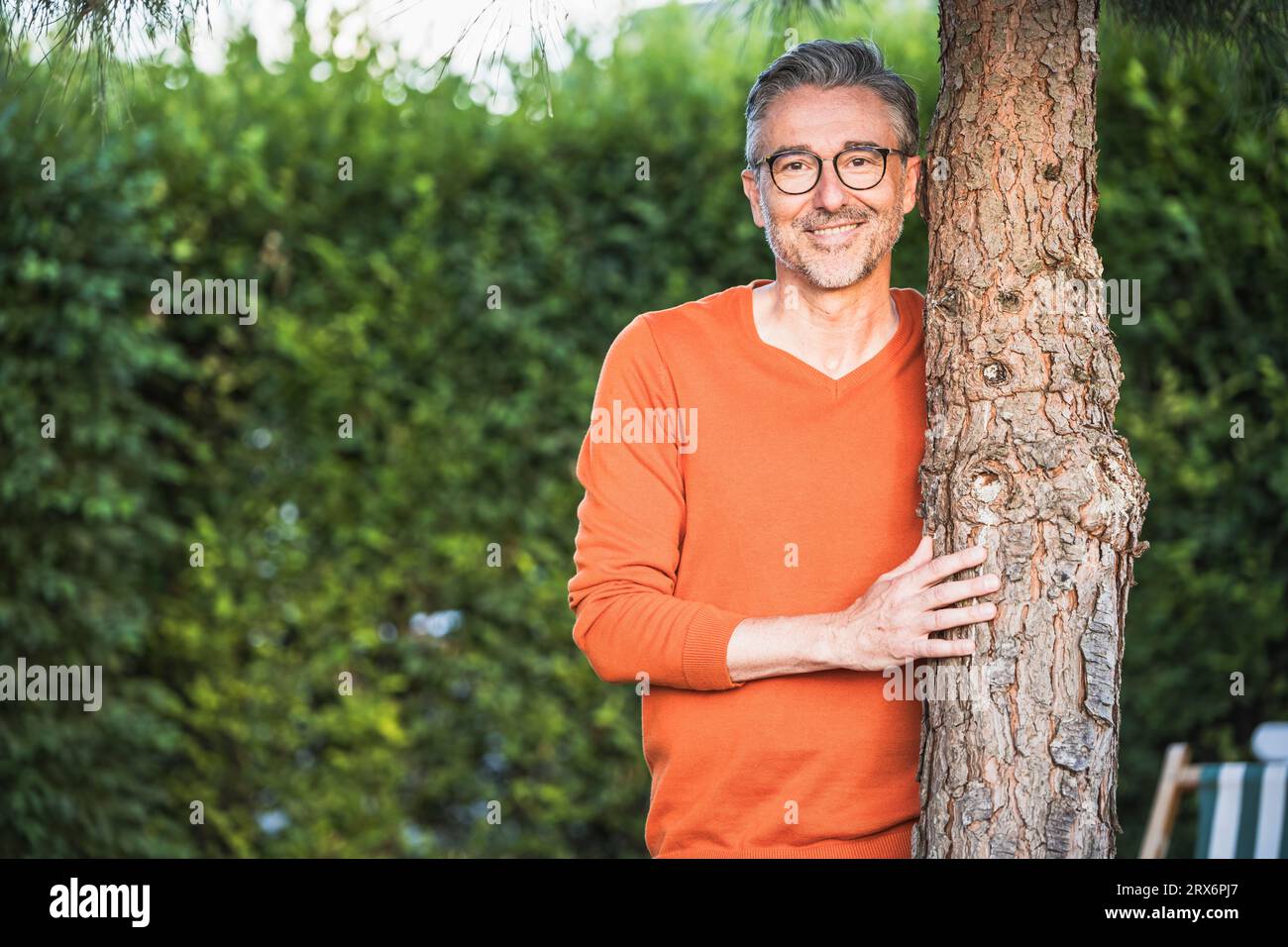 Man standing on the orange tree hi-res stock photography and images - Alamy