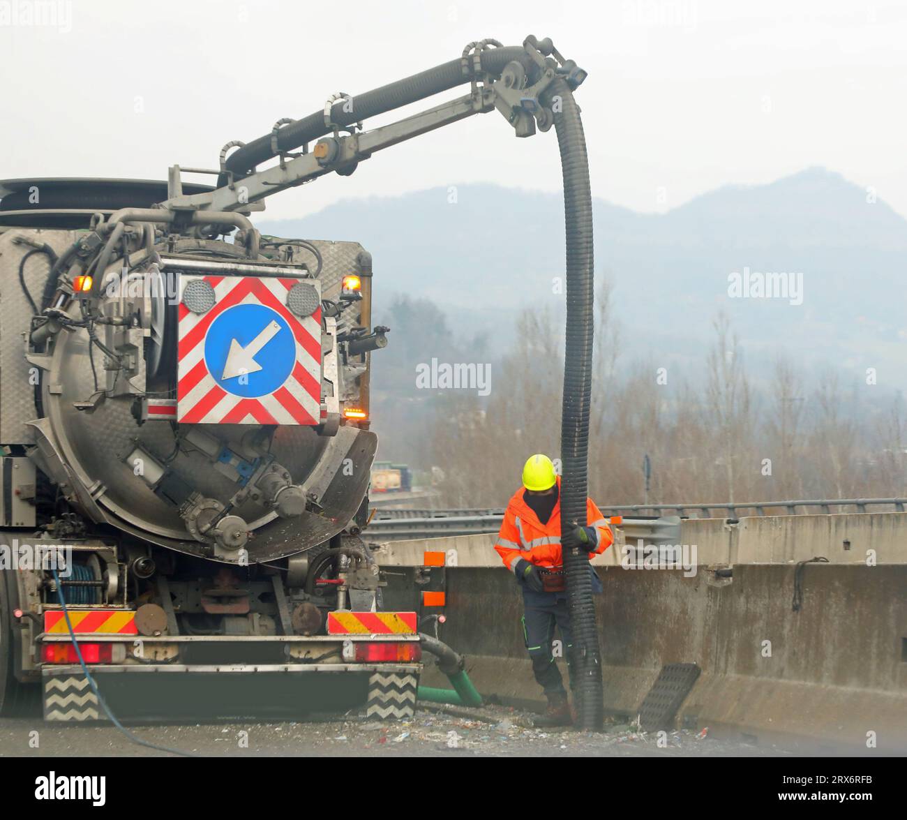 large truck with hose for maintenance of motorways and highways and the ...