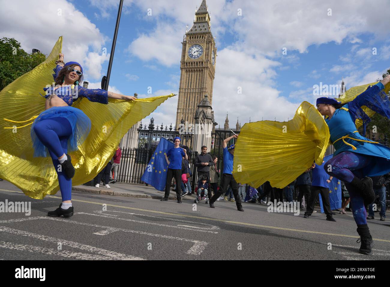 People take part in a Rejoin march outside the gates of the Houses of ...