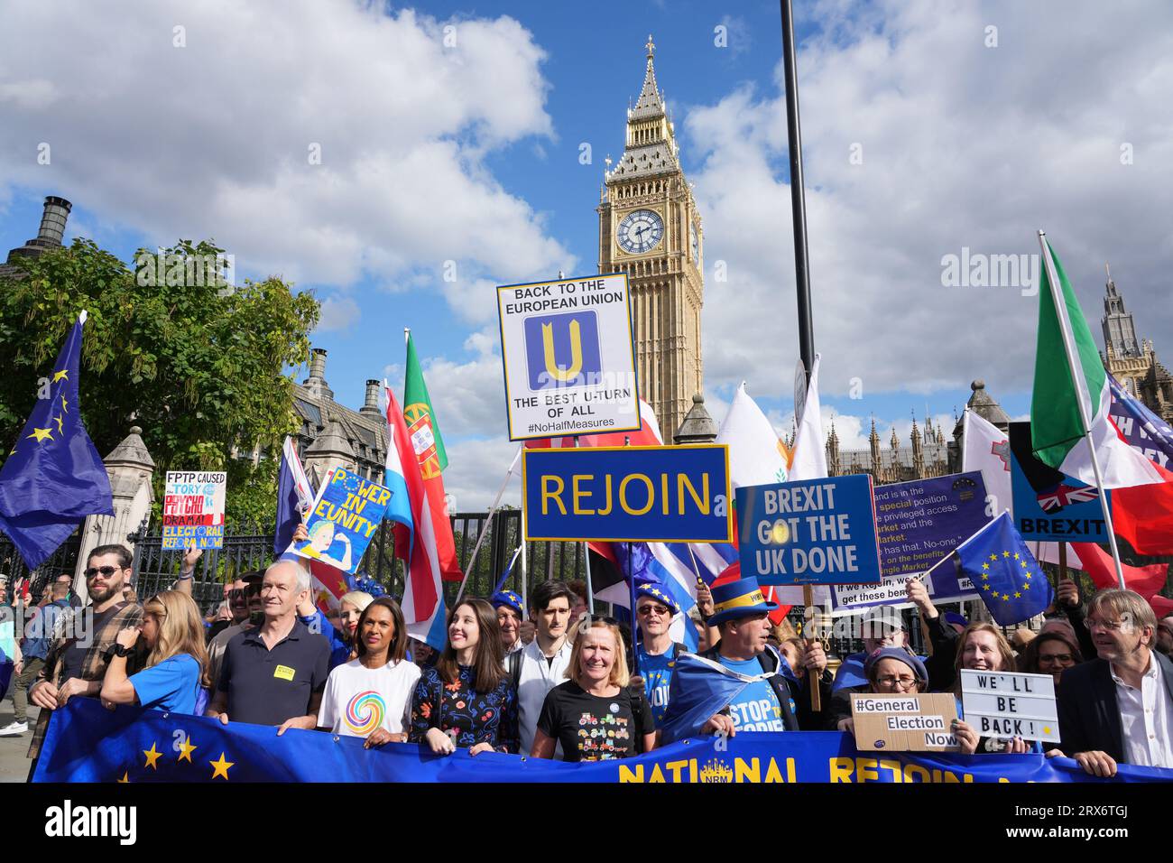 People take part in a Rejoin march outside the gates of the Houses of ...