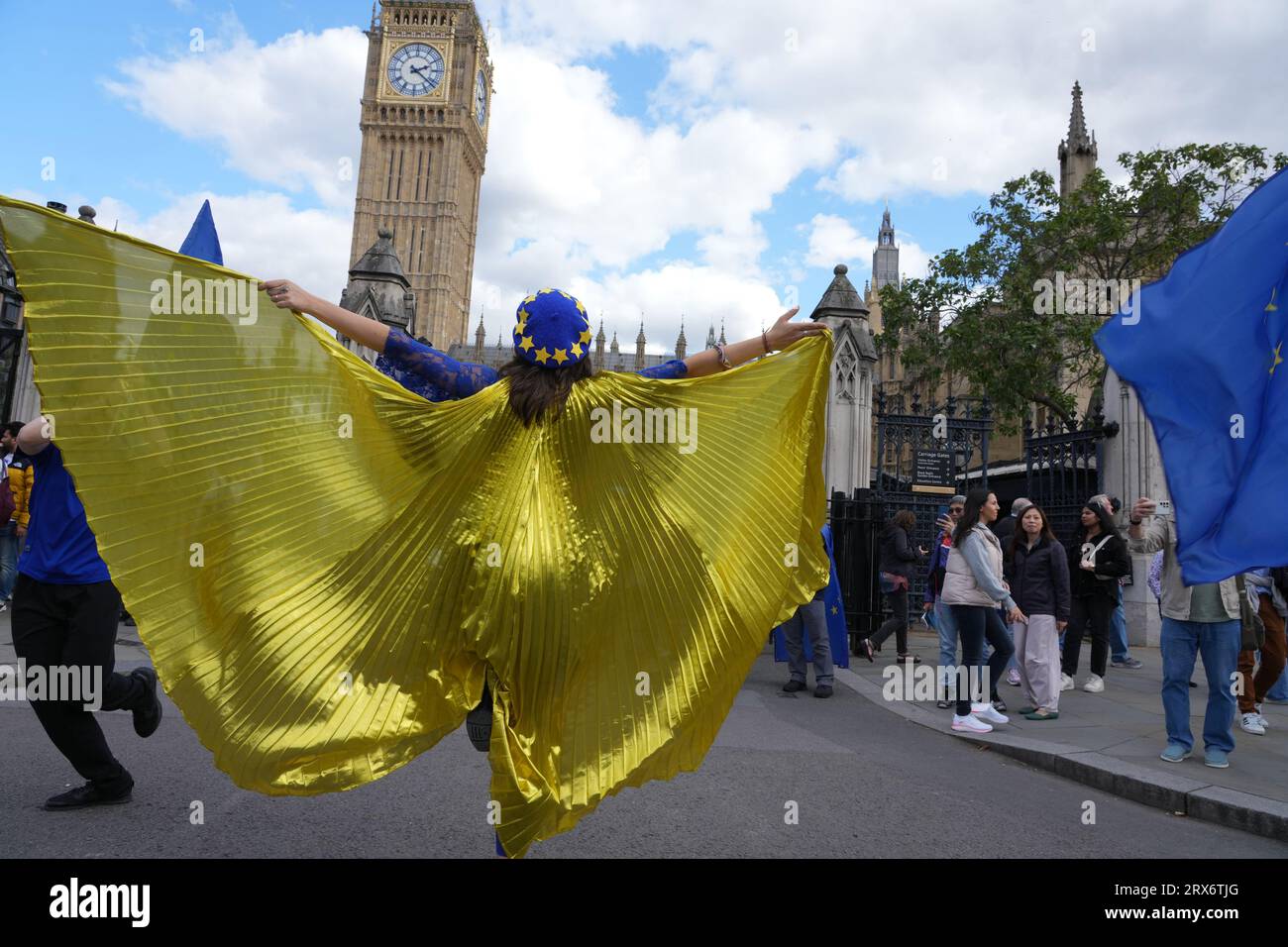People take part in a Rejoin march outside the gates of the Houses of ...