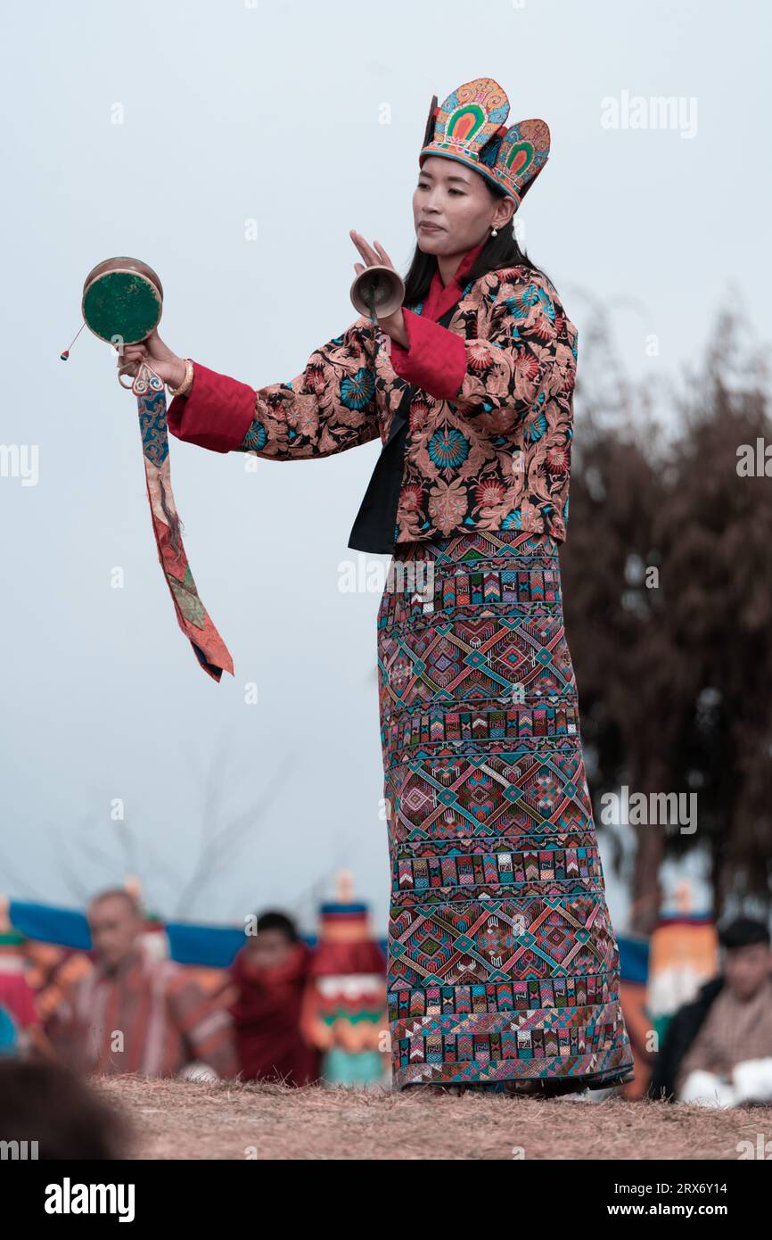 Beautiful woman performing ritual dance in colorful attire Stock Photo ...