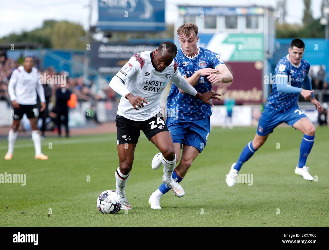 Derby County's Ryan Nyambe (left) and Carlisle United's Owen Moxon ...