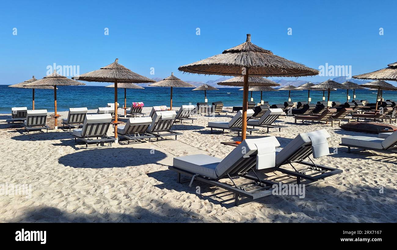 Landscape view of a nice beach with sunumbrellas and sunbeds Stock ...