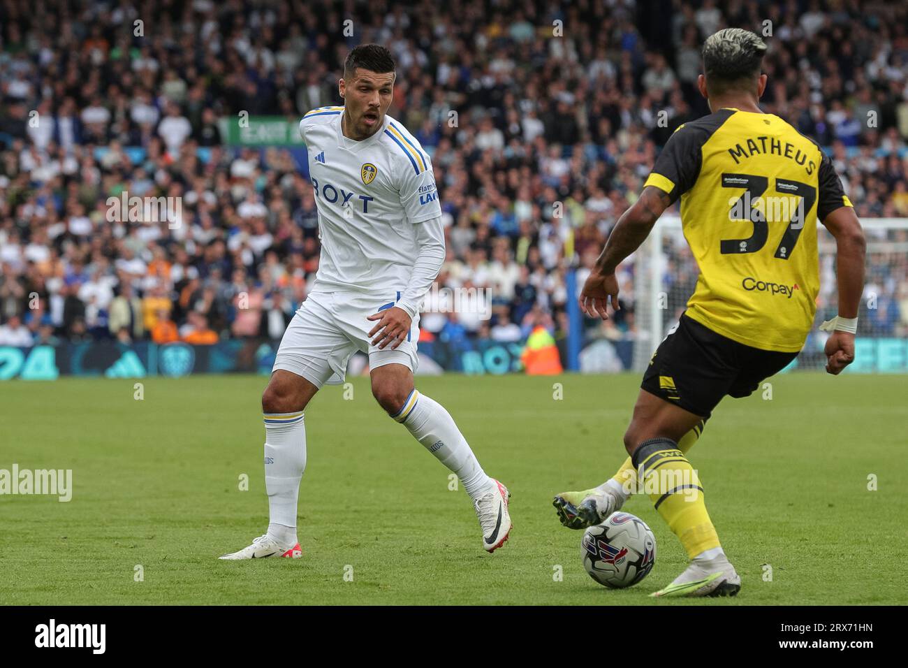 Joël Piroe #7 of Leeds United tracks Matheus Martins #37 of Watford ...