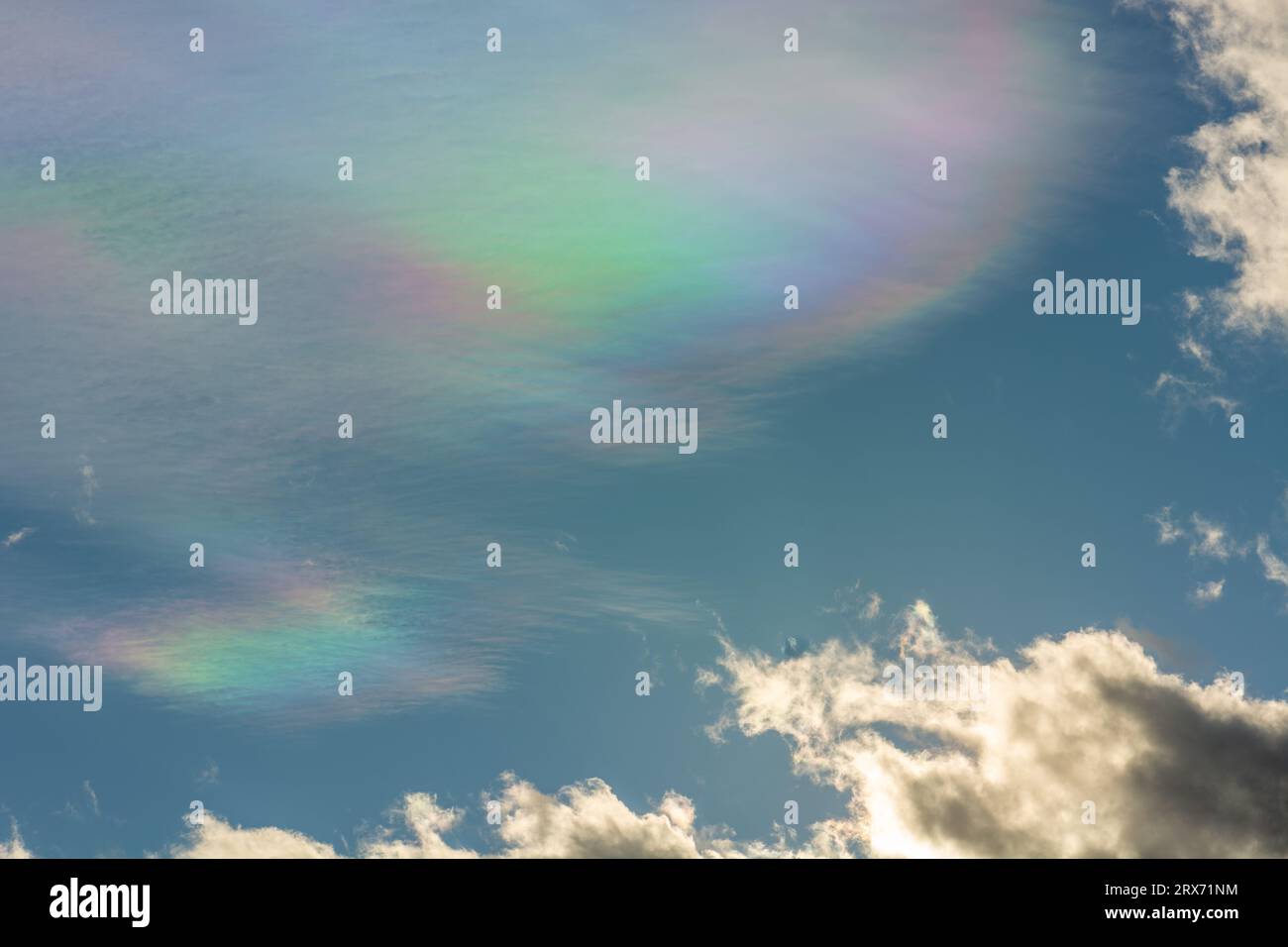 Quite rare optical phenomenon of iridescence of clouds of pearly, pink ...