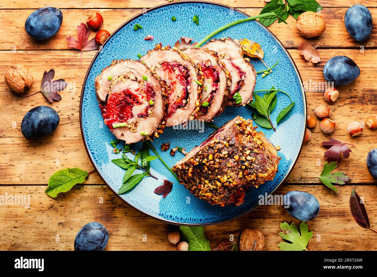 Sliced meatloaf stuffed with plums. Autumn meat recipe, roasted ...