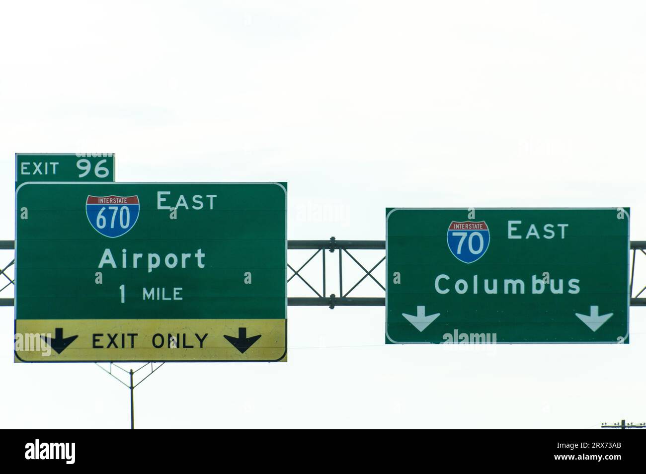 US Highway overhead board indicating directions above lanes Stock Photo ...