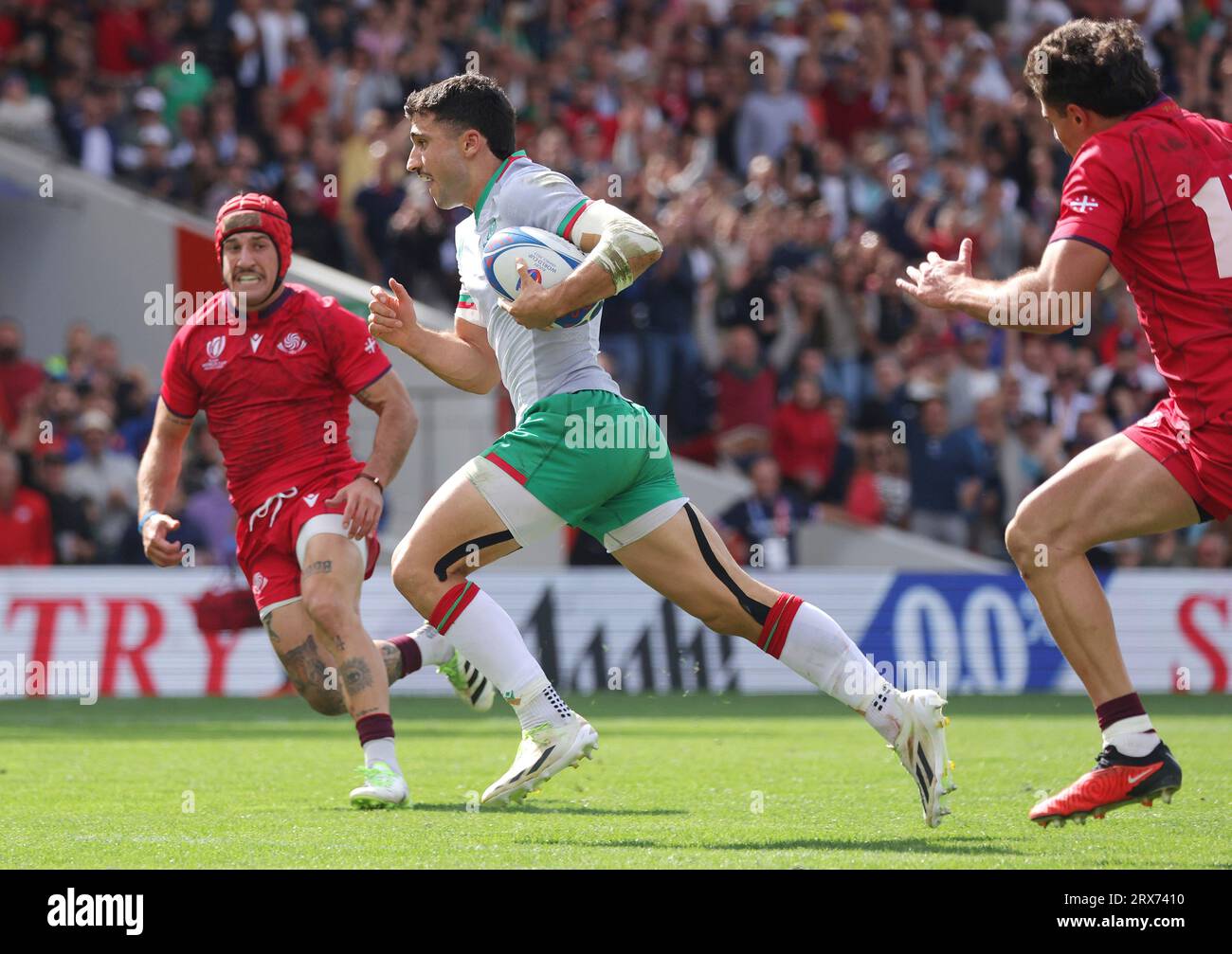 Raffaele Storti of Portugal scores a try in the second half of pool C ...