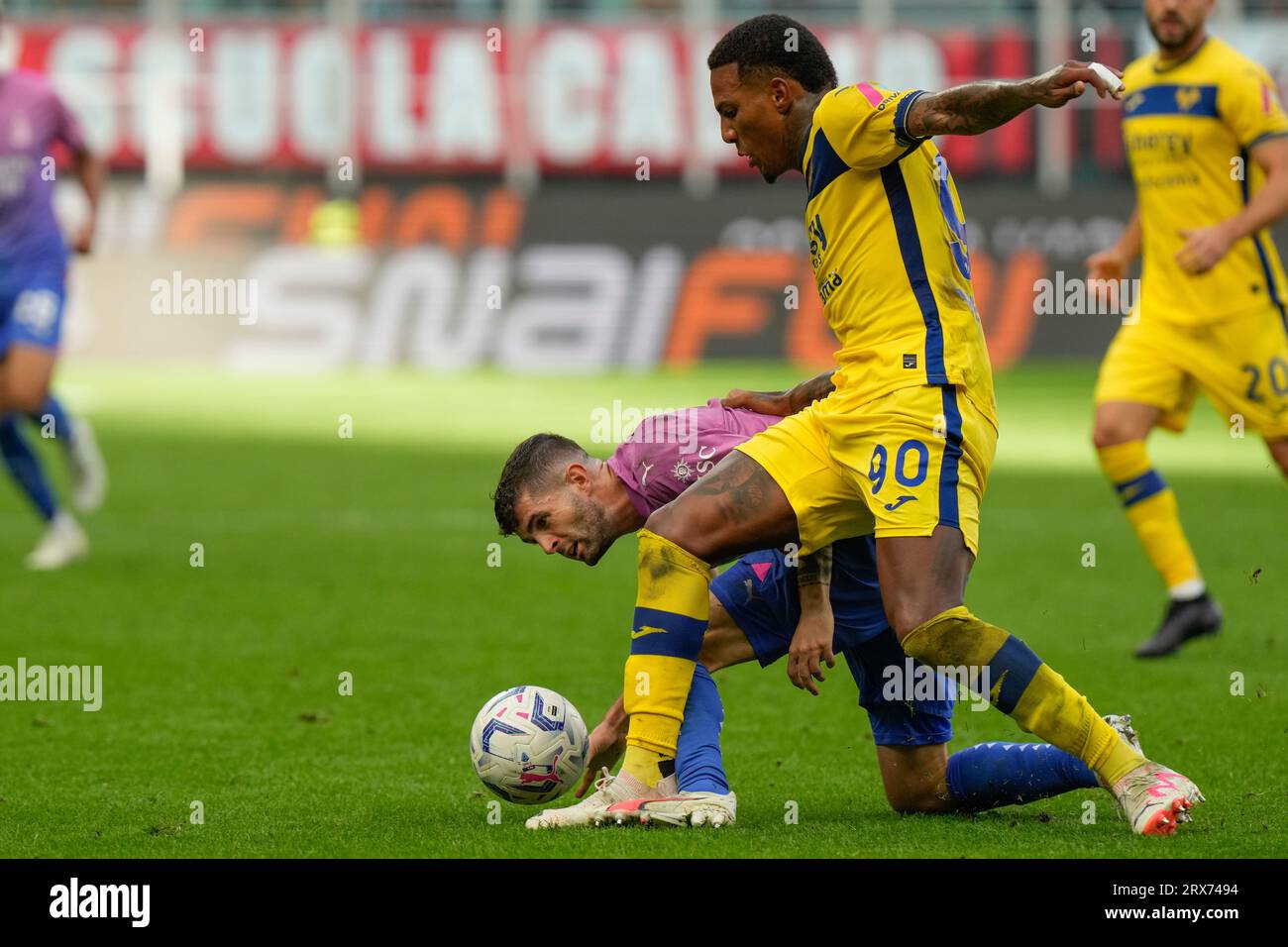 AC Milan's Christian Pulisic, left, and Verona's Michael Folorunsho vie ...