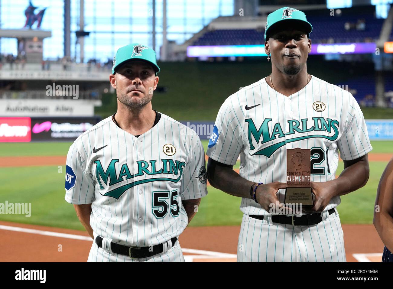 Miami Marlins' Jorge Soler, right, waves as he stands with Miami ...