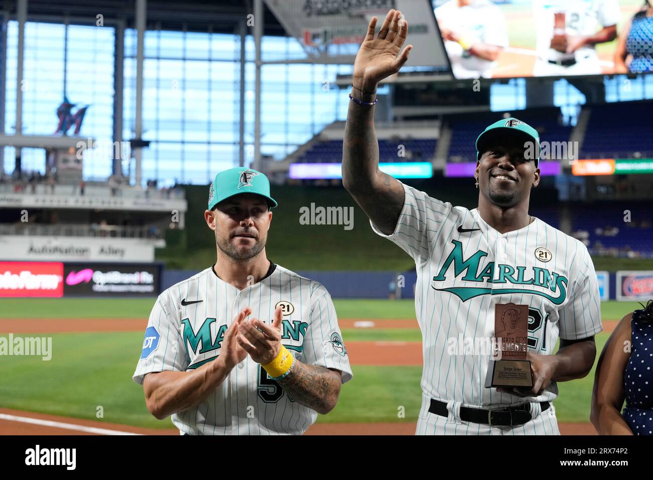 Miami Marlins' Jorge Soler, right, waves as he stands with Miami ...