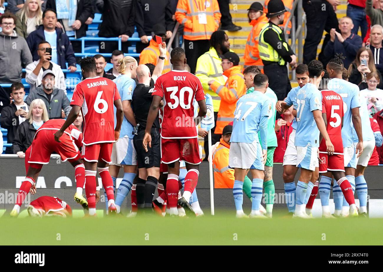 Manchester City's Rodri (third right, hidden) is shown a red card by ...