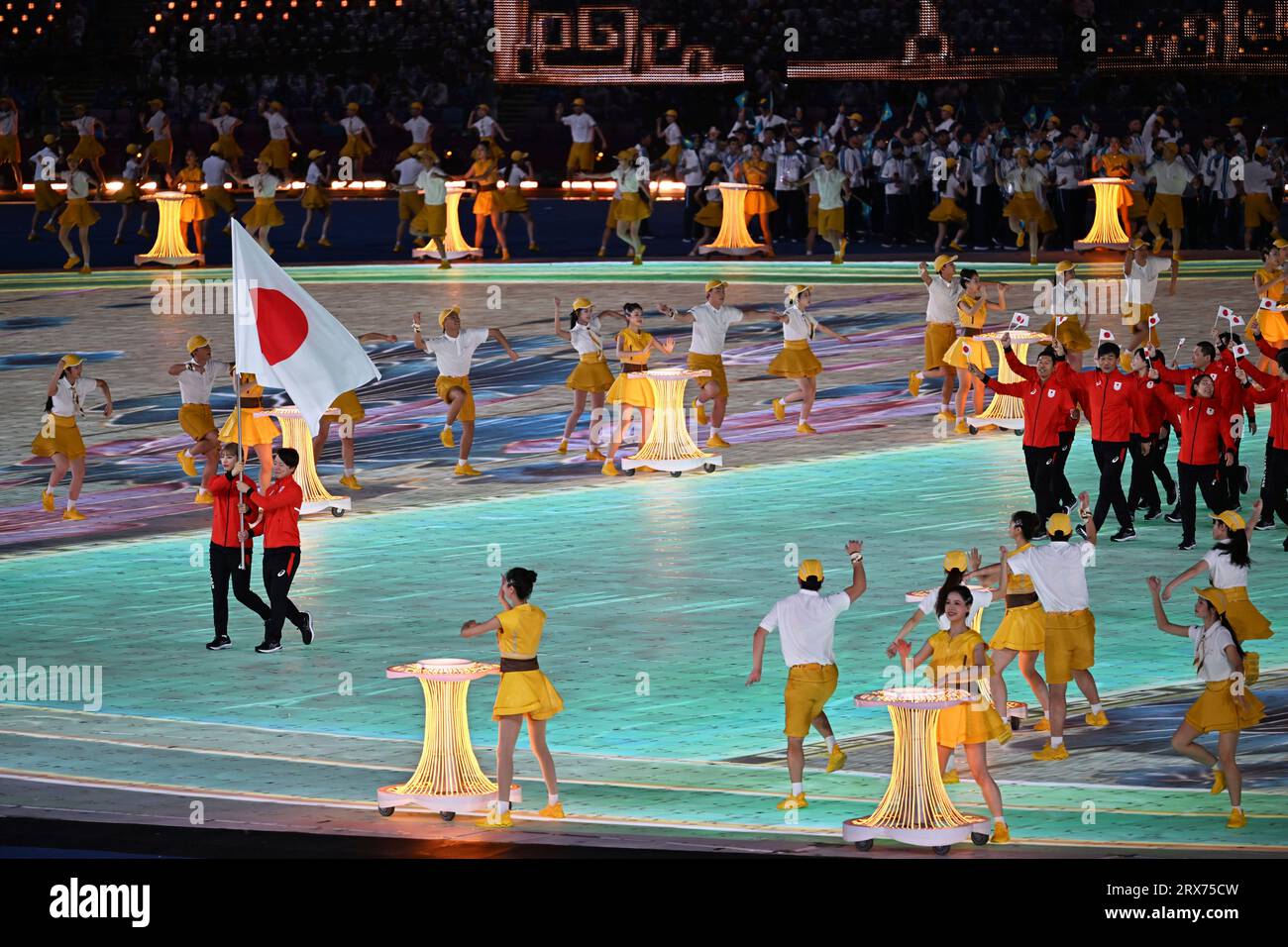 The Japanese delegation enter the stadium in the opening ceremony of ...