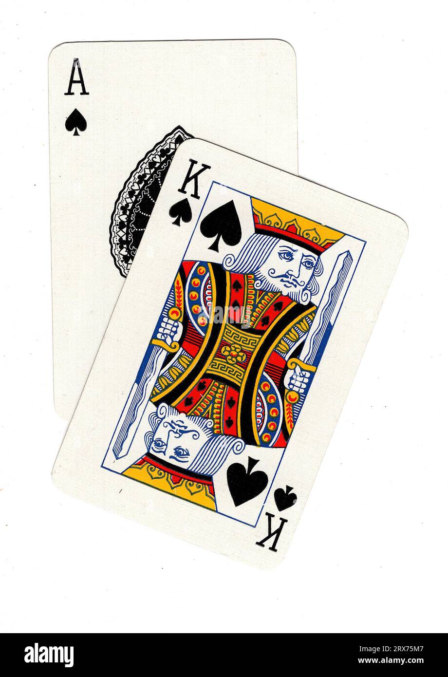 A blackjack hand of playing cards showing an ace and king on a white ...