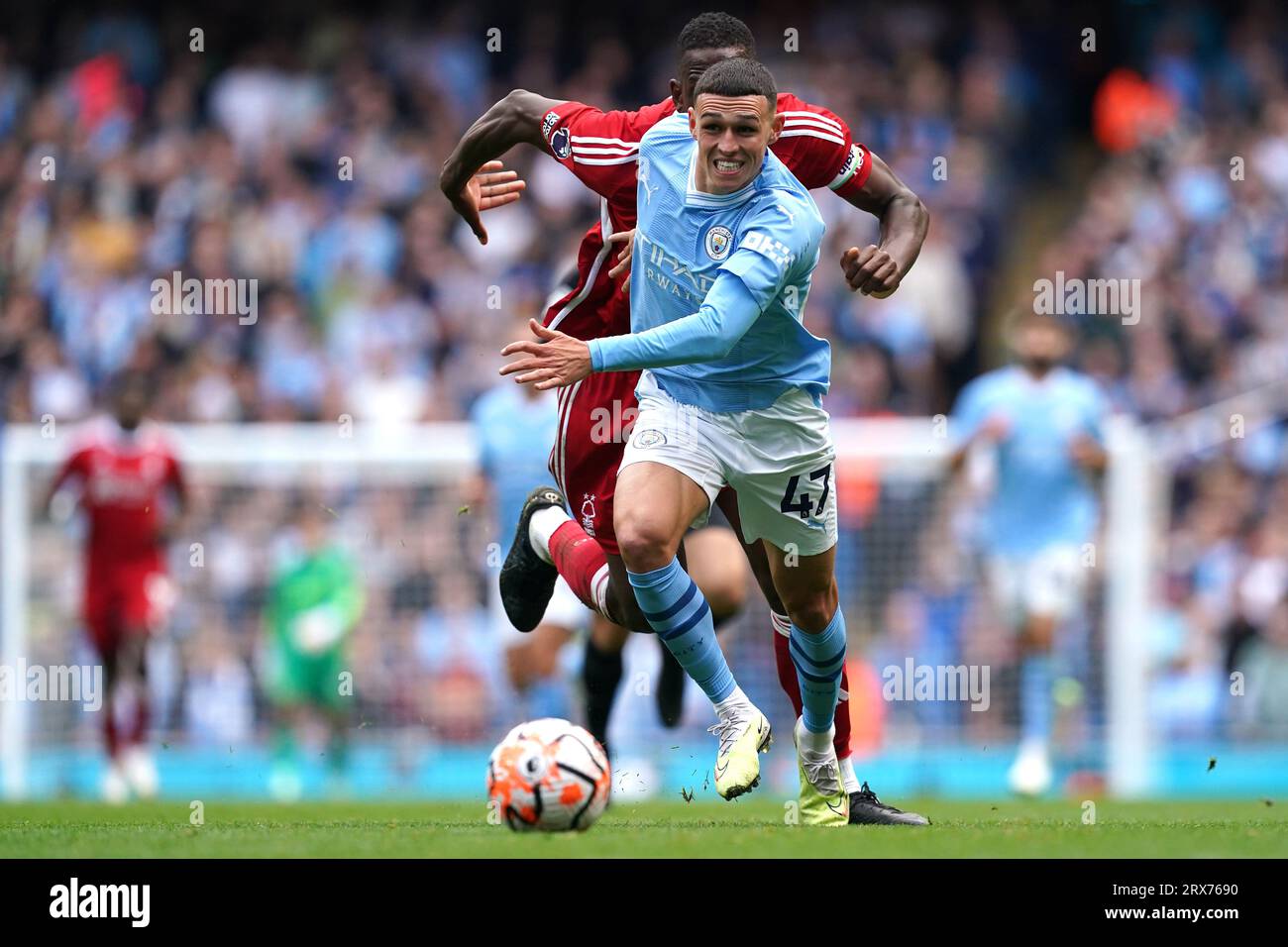 Manchester City's Phil Foden (right) and Nottingham Forest's Willy Boly ...