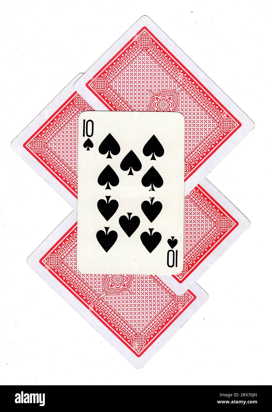 A montage of vintage playing card backs with the ten of spades revealed ...