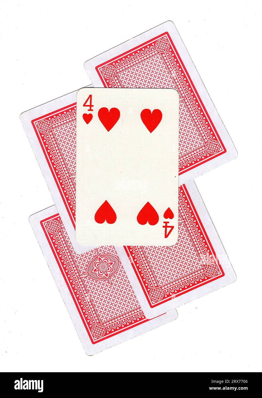 A montage of vintage playing card backs with the four of hearts ...
