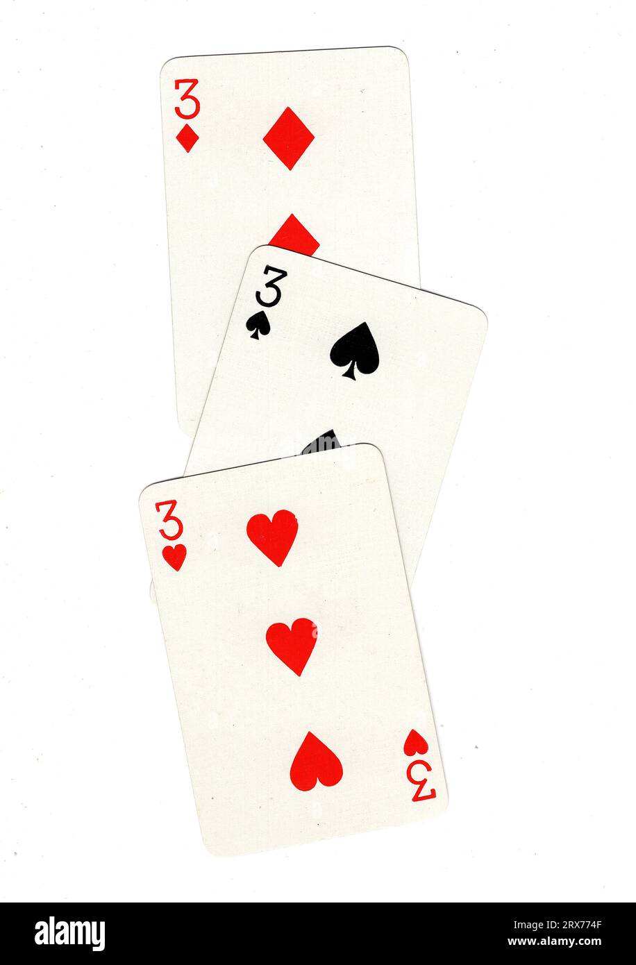Vintage playing cards showing three threes on a white background Stock ...