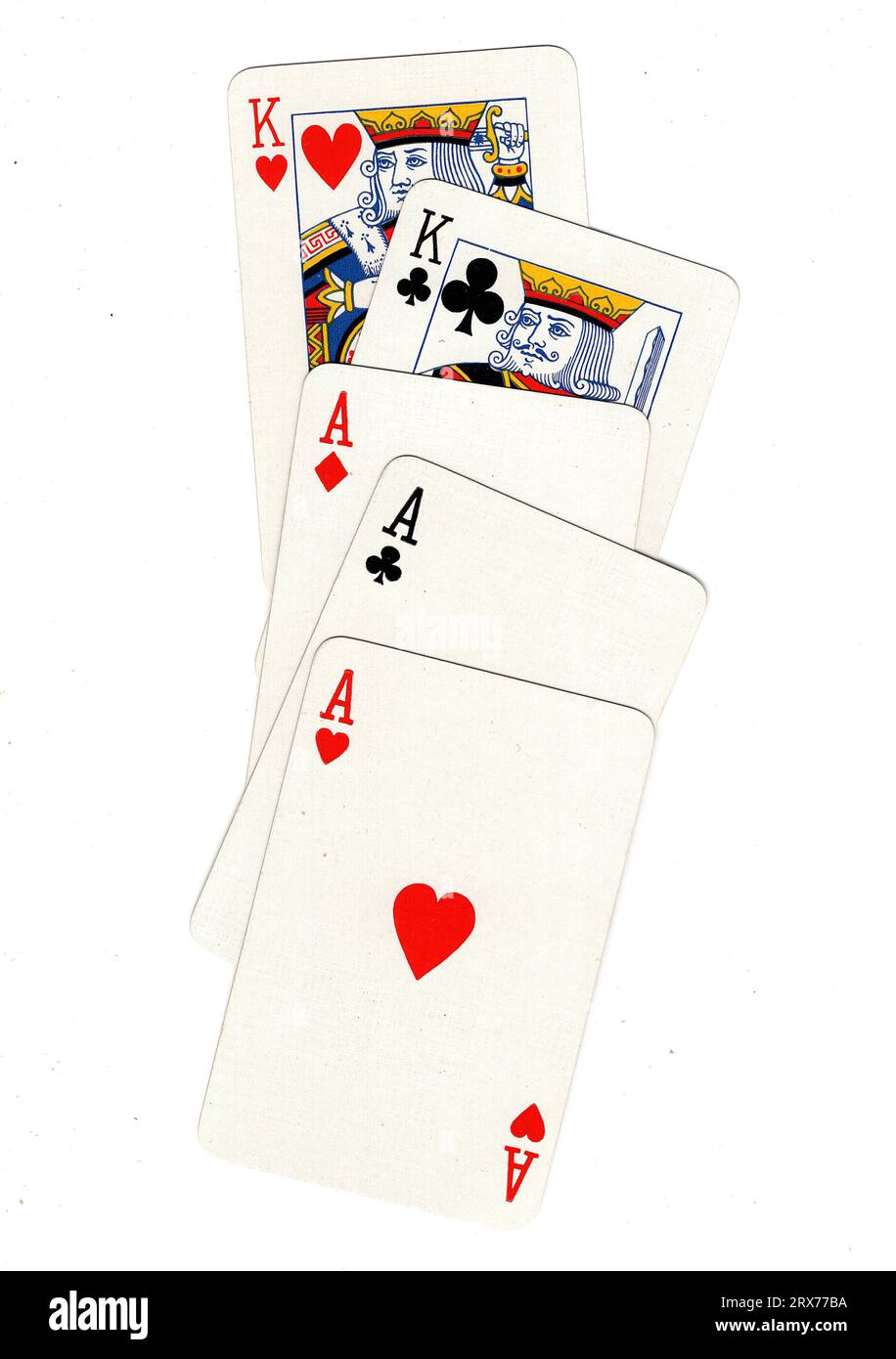 A hand of vintage poker playing cards featuring a full house of aces ...