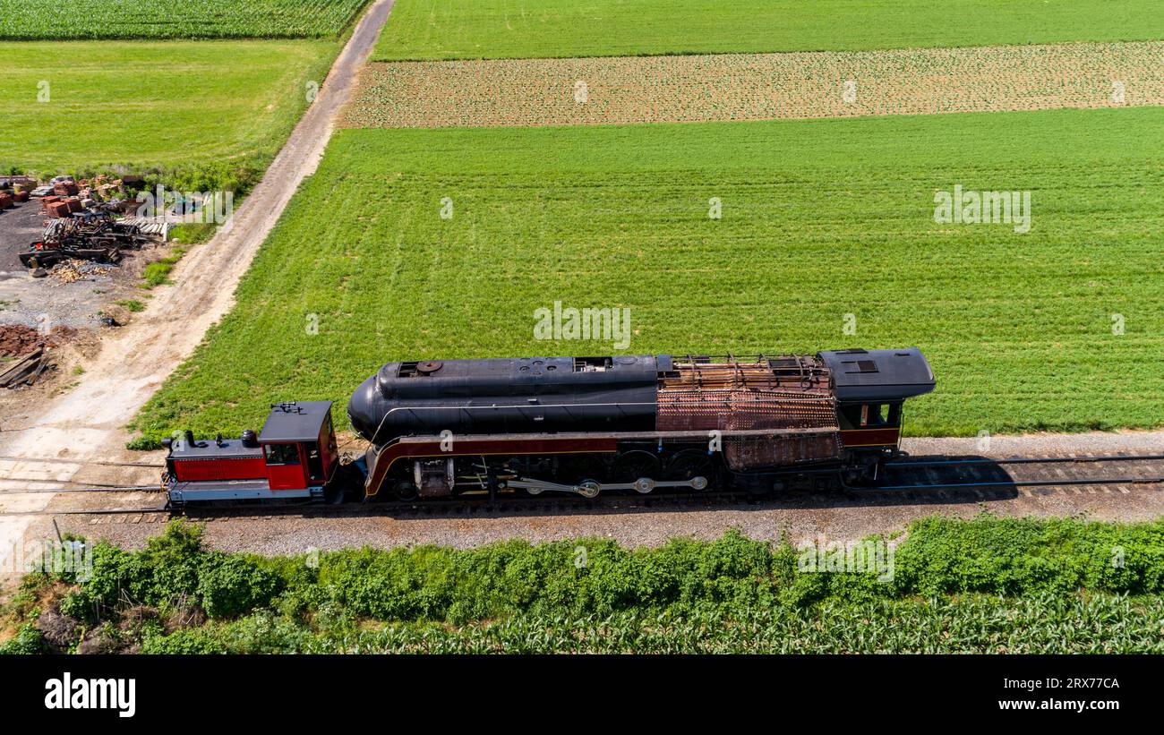 A Drone View of An Antique Steam Locomotive Being Repaired, With it's ...