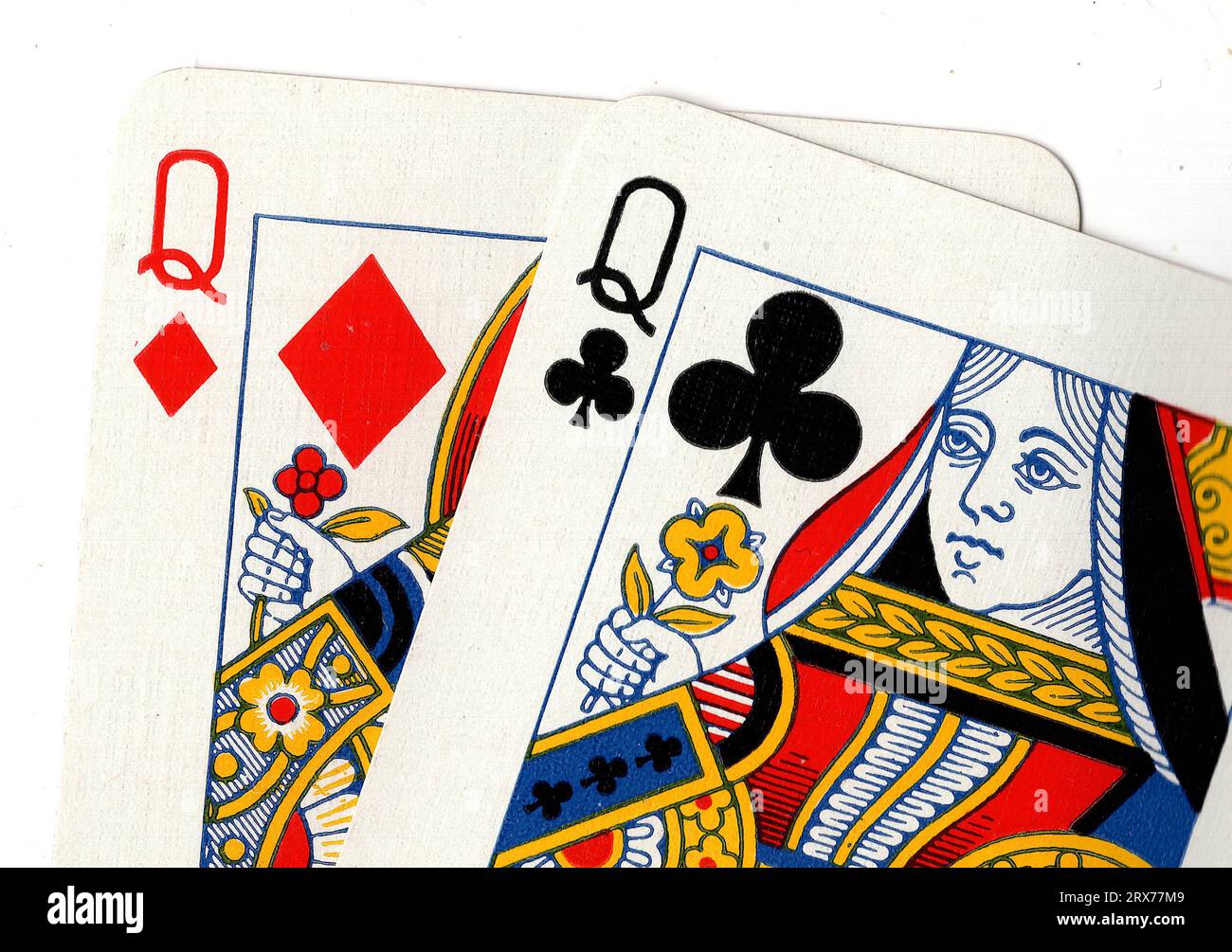 Vintage playing cards showing a pair of queens on a white background ...