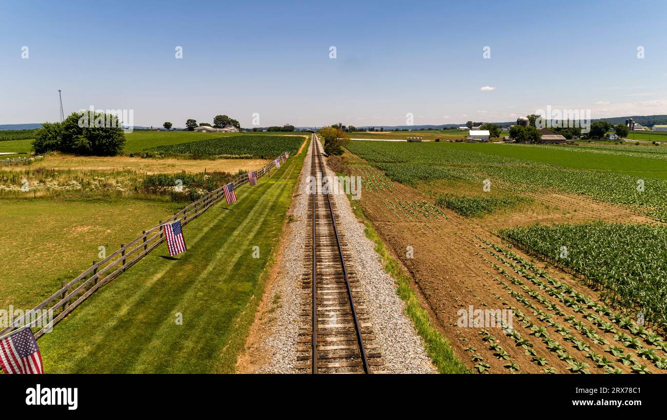 An Aerial View on a Single Railroad Track With a Fence With America ...