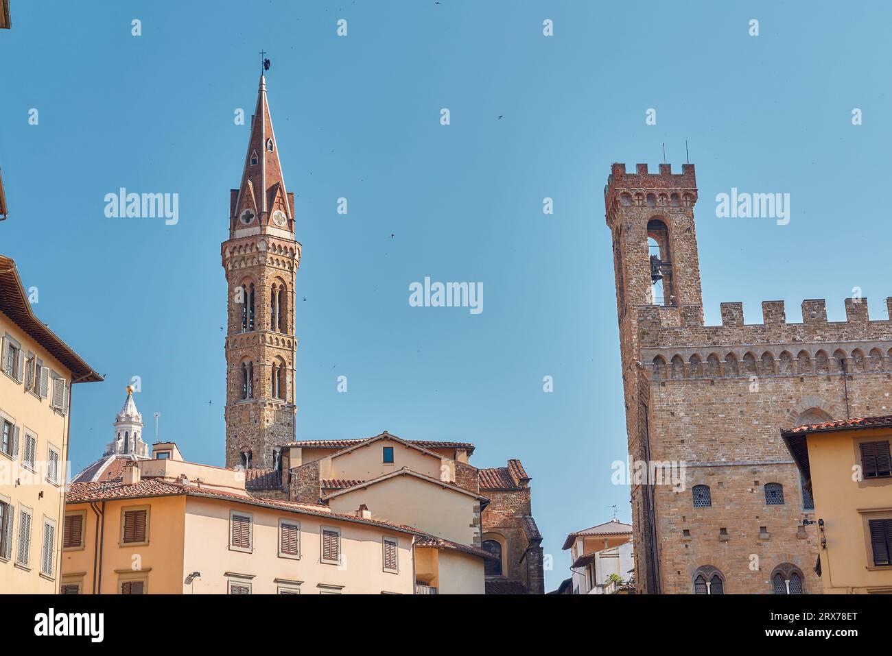 Badia Fiorentina church tower and Bargello museum tower with blue sky ...