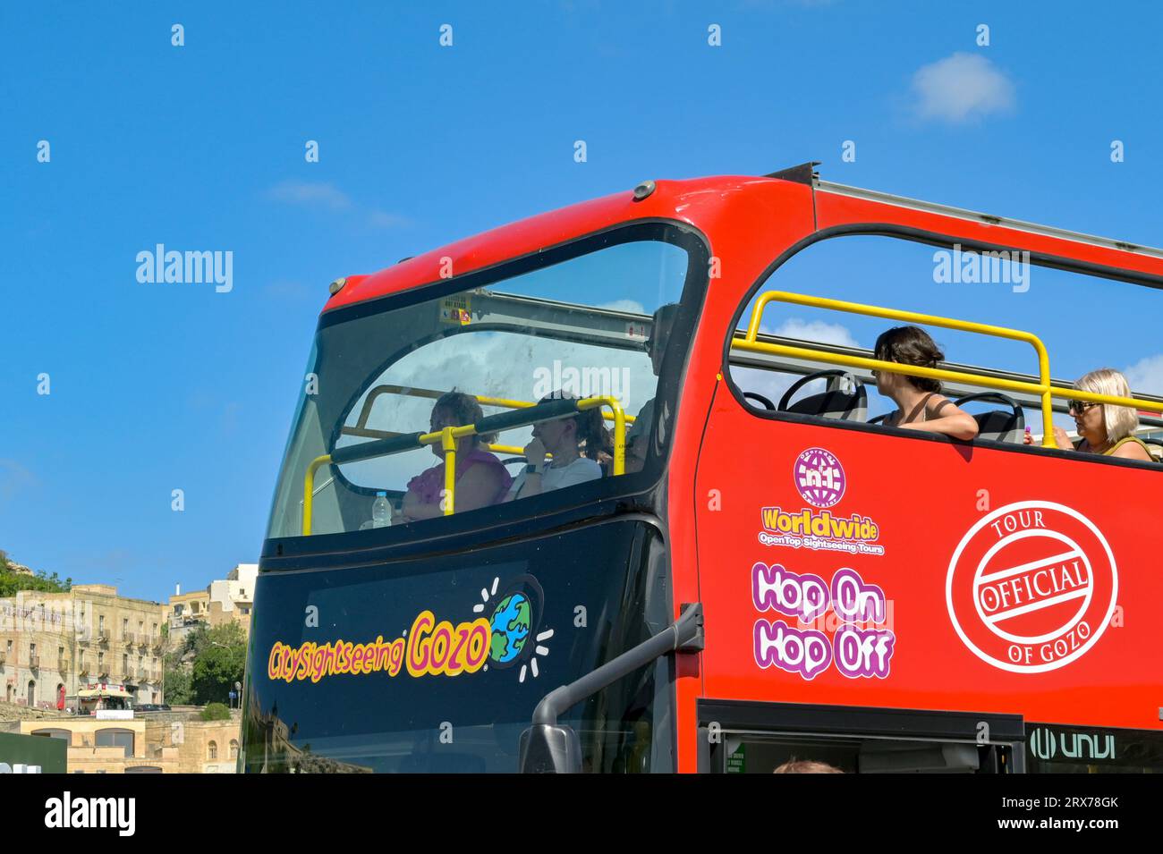 Gozo, Malta - 5 August 2023: Visitors to Gozo sitting on the top decl ...
